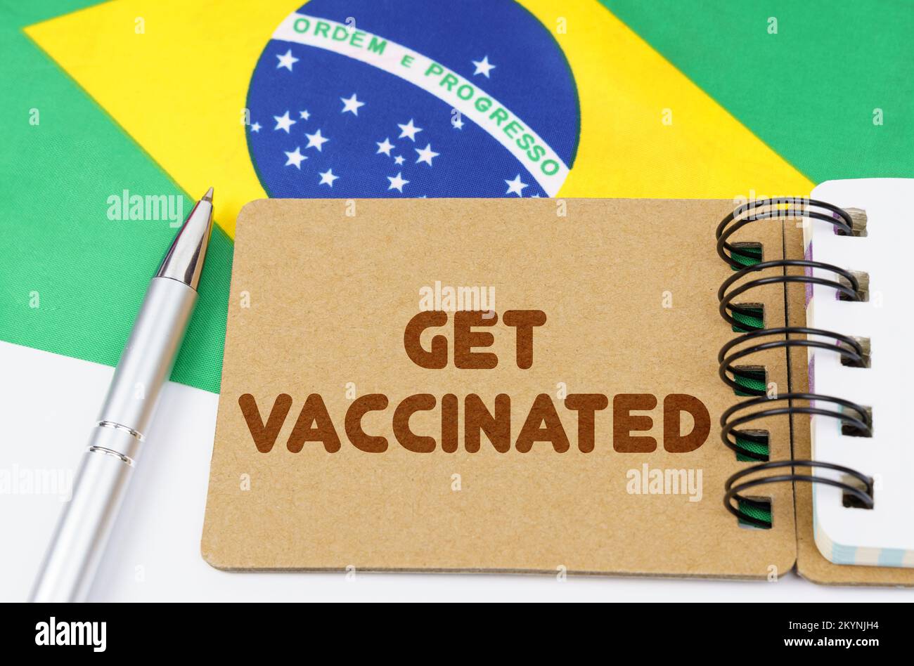 National medicine concept. On the flag of Brazil lies a notebook with ...