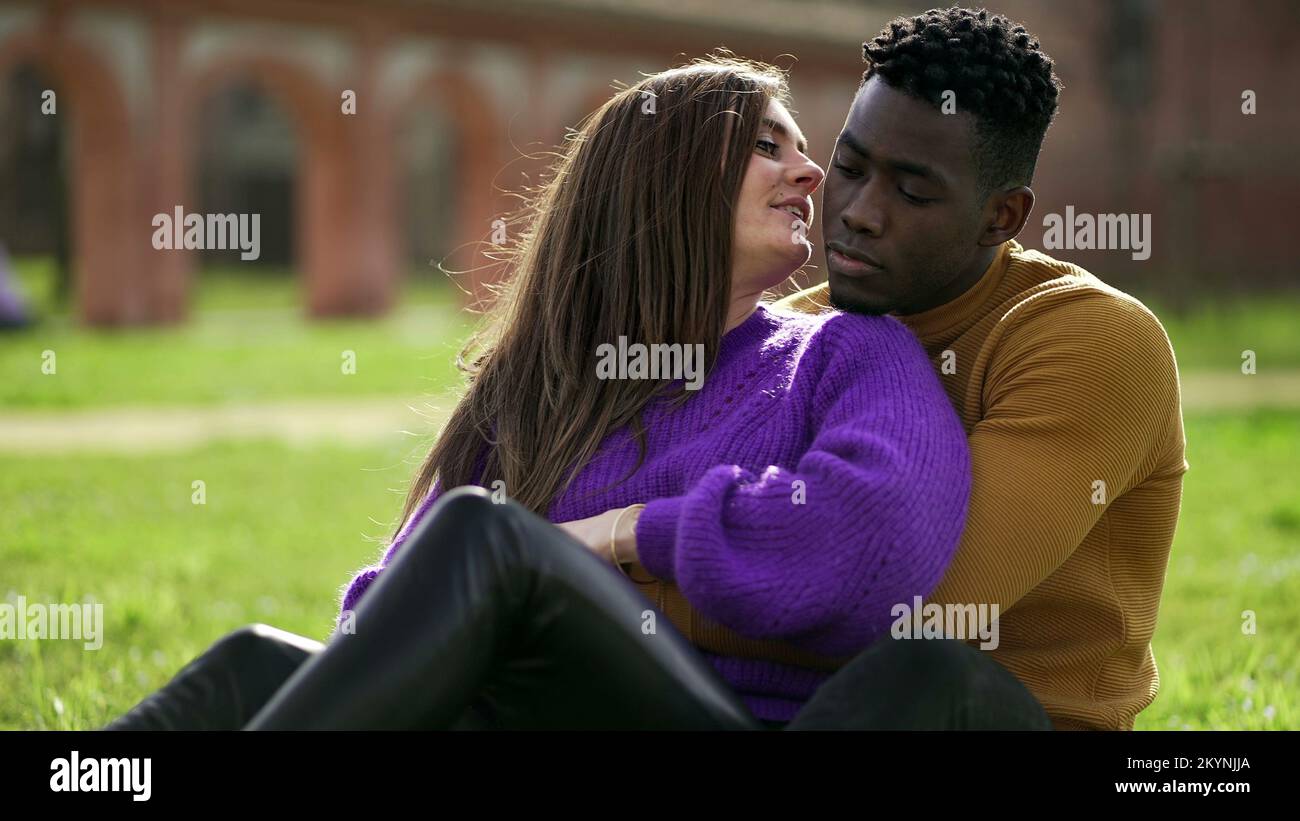Young interracial couple dating at park, ethnically diverse ...