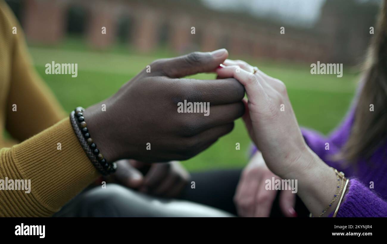 Young interracial couple hands and arms caress and affection together2 ...