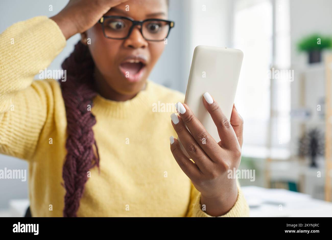 Surprised Amazed Young Woman Is Looking At Shocking Message On Her