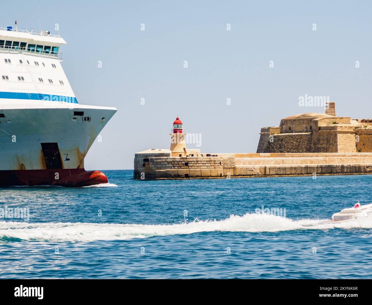 Valletta, Malta - May 2021. A huge cargo ship enters the port of ...