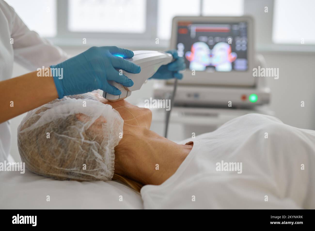 Cosmetologist applying laser to facial hair remove Stock Photo - Alamy