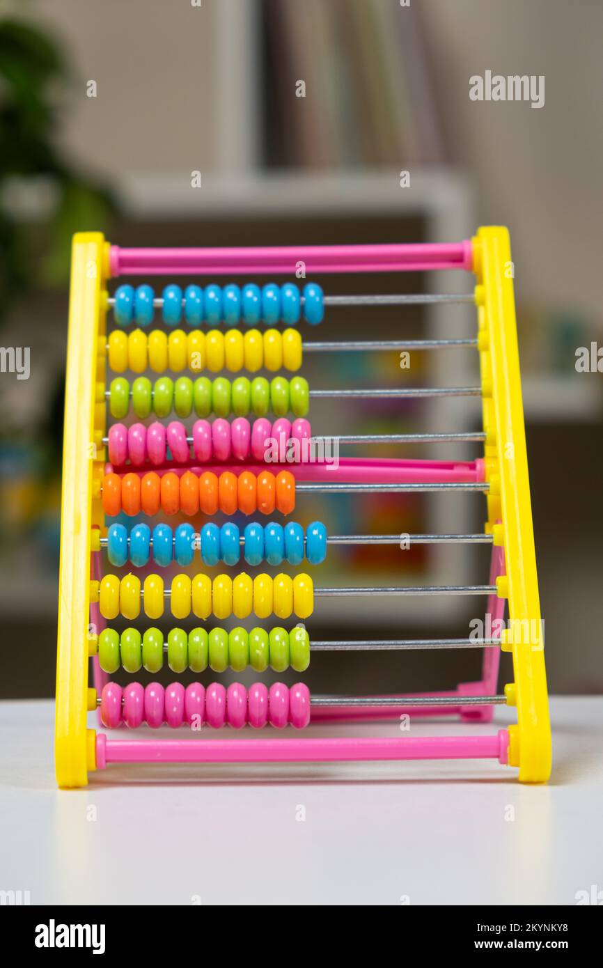 Colorful children's abacus on the table. Mathematics, arithmetic for ...
