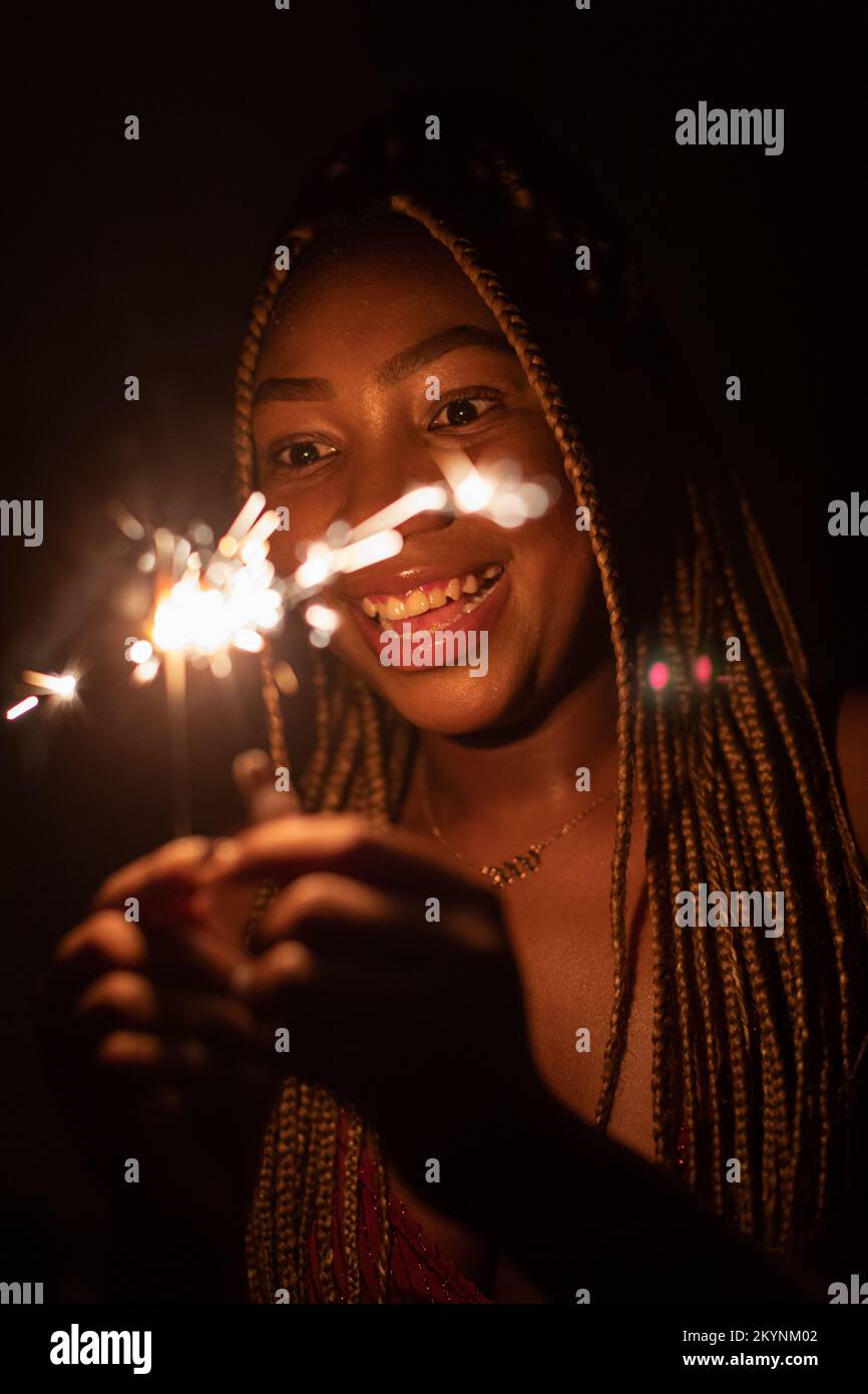 An Attractive Dark Skinned Girl Holds Burning Cold Fires In Her Hand