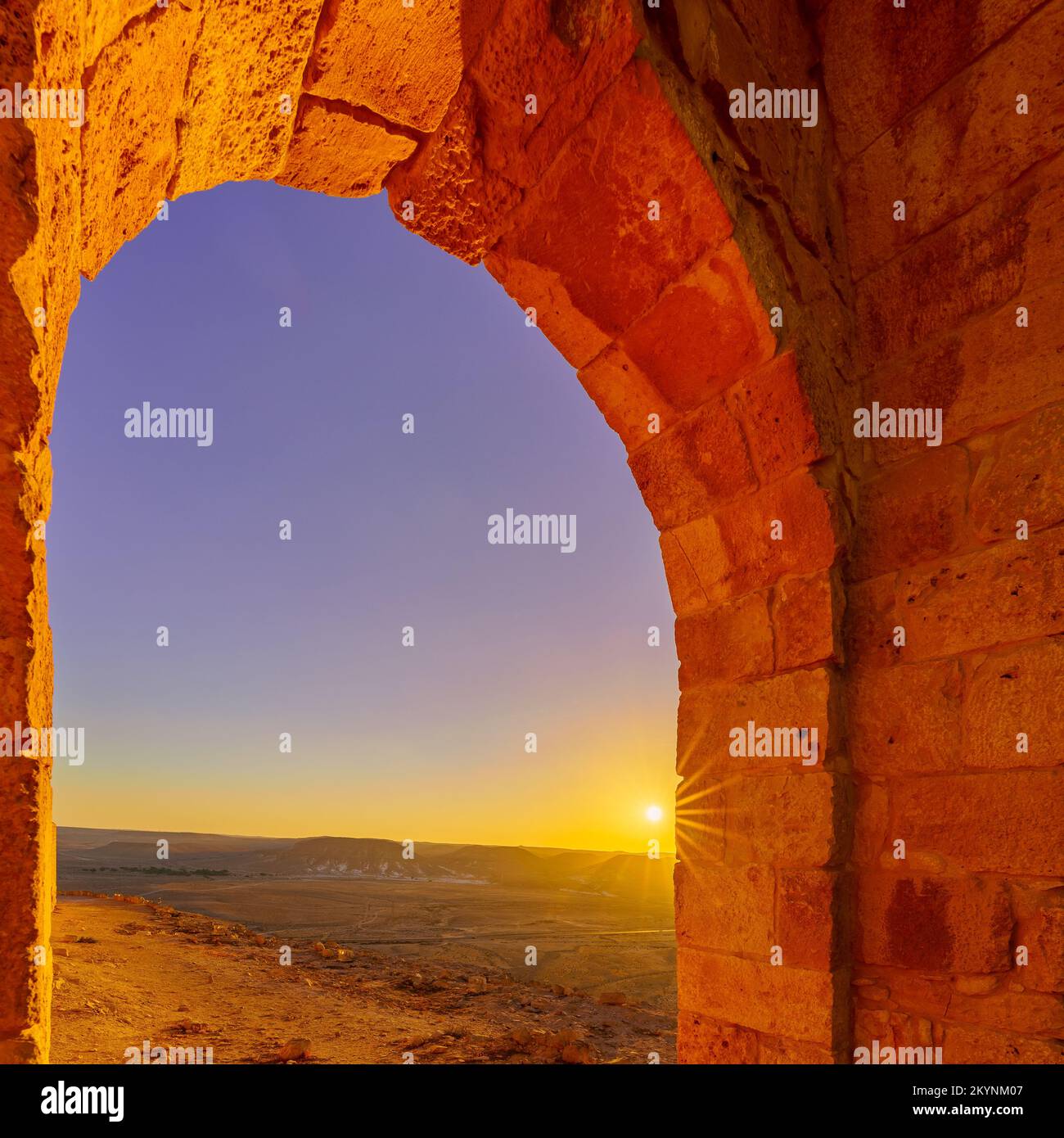 Sunset view with an ancient gate, in the Nabataean city of Avdat, the ...