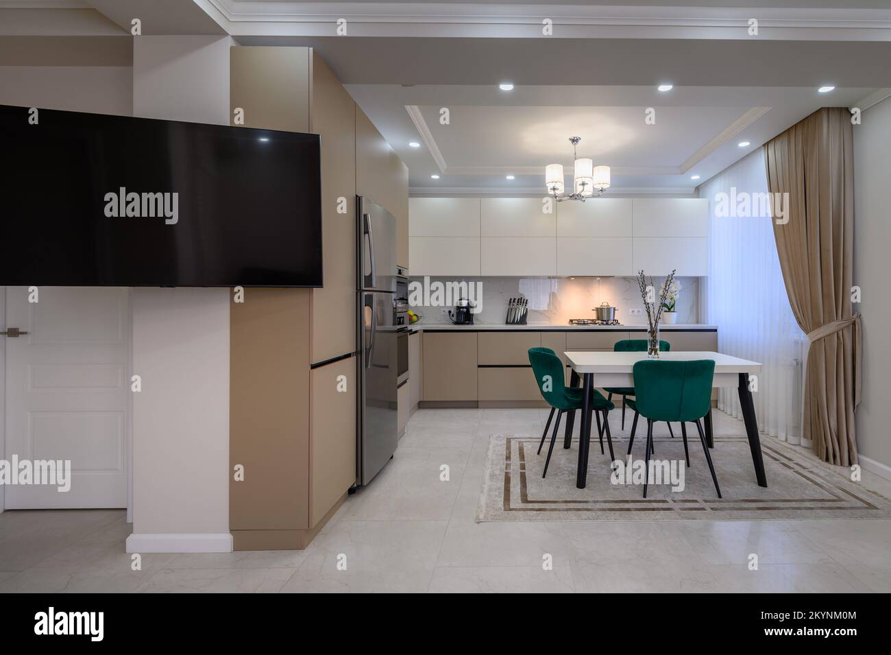 Modern classic white and beige kitchen with dining room in the interior ...