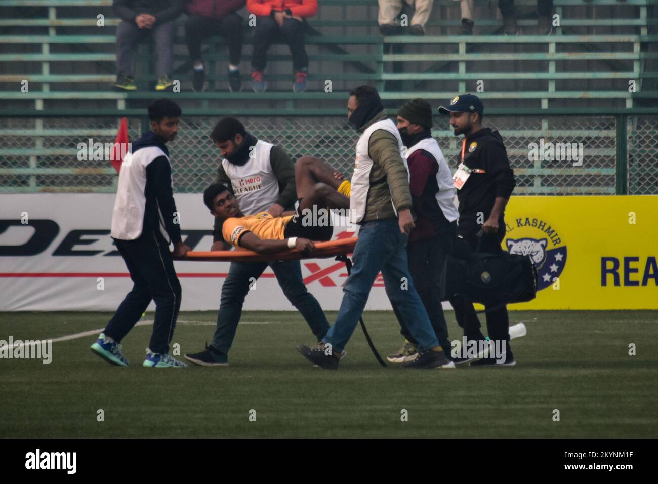 Srinagar, India. 01st Dec, 2022. Paramedics carry an injured football ...