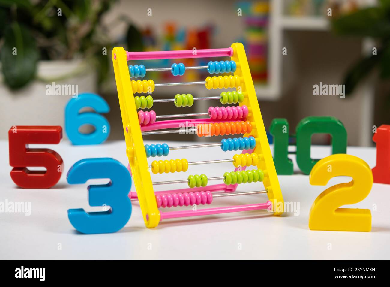 Colorful children's abacus on the table. Mathematics, arithmetic for ...