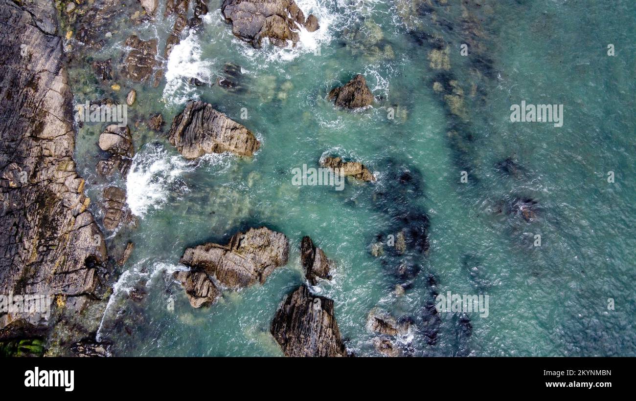 A lot of boulders in the sea. Coastal cliffs of the North Atlantic ...