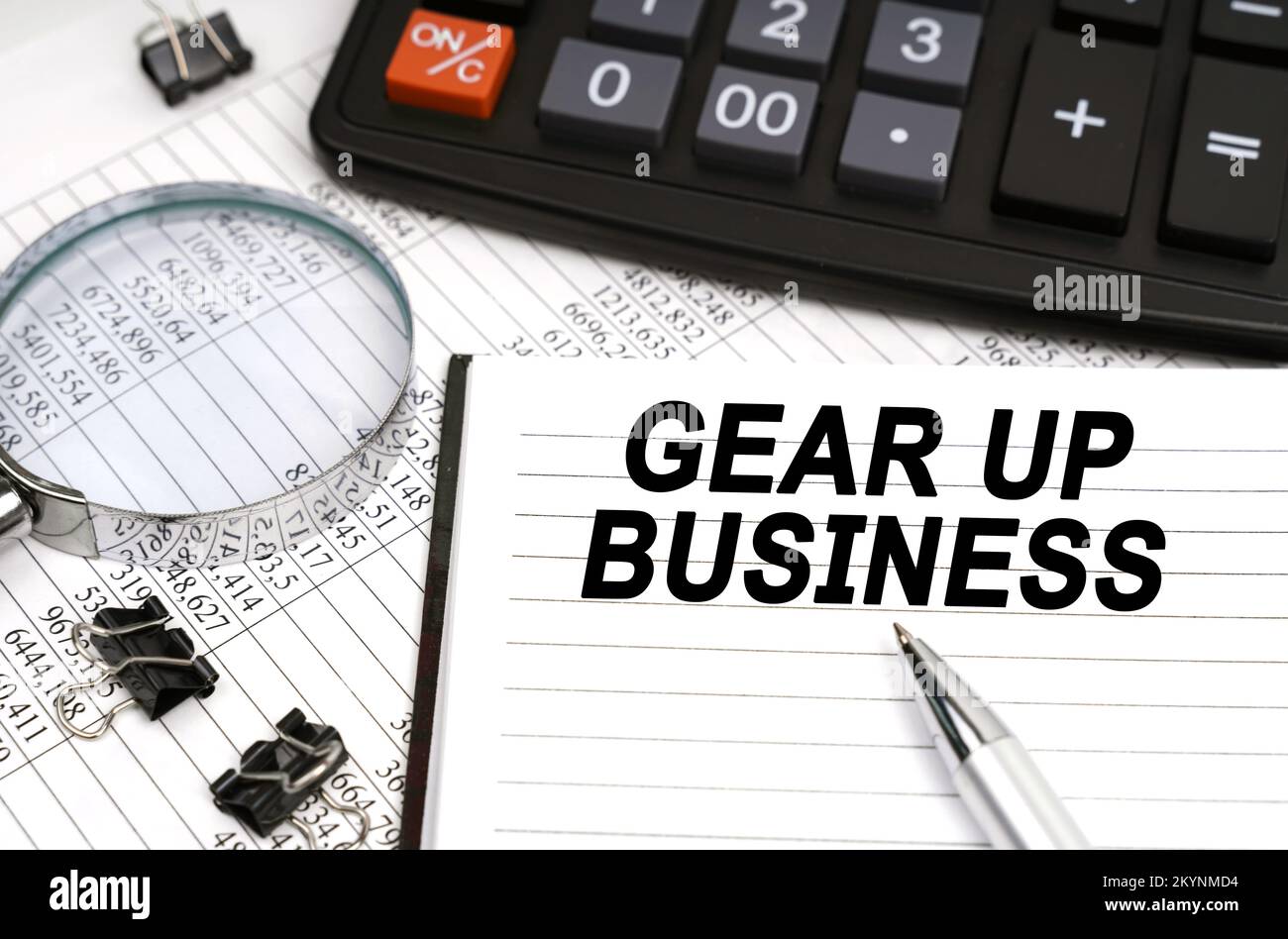 Business concept. On the table is a magnifying glass, a calculator, a ...