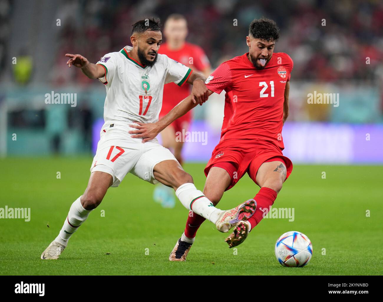 Doha, Qatar. 1st Dec, 2022. Sofiane Boufal (L) of Morocco and Jonathan ...