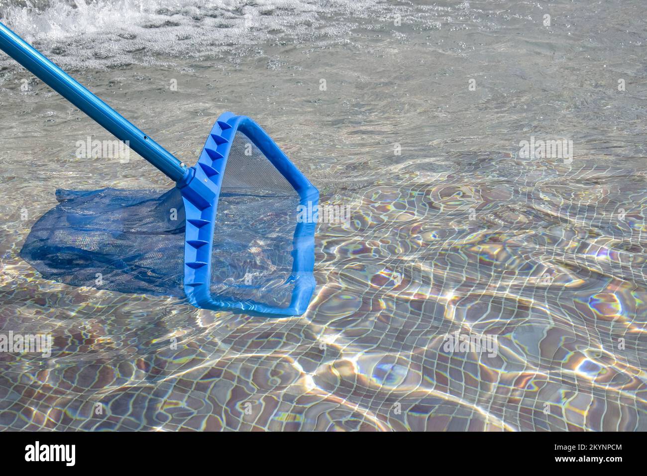 Mesh net for cleaning pool from debris. Cleaning pool, city fountain ...