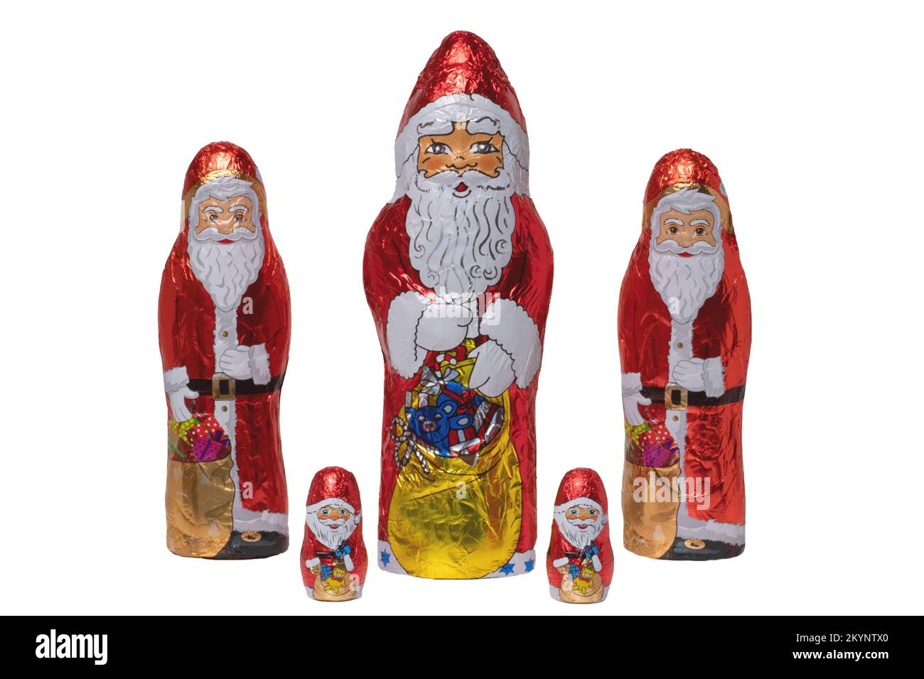 Chocolate Santa isolated. Close-up of five cheerful wrapped chocolate ...