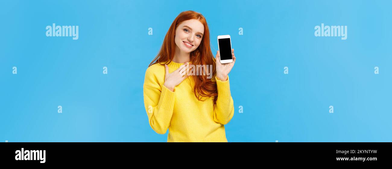 Touched lovely and romantic redhead cute woman bragging with photos ...