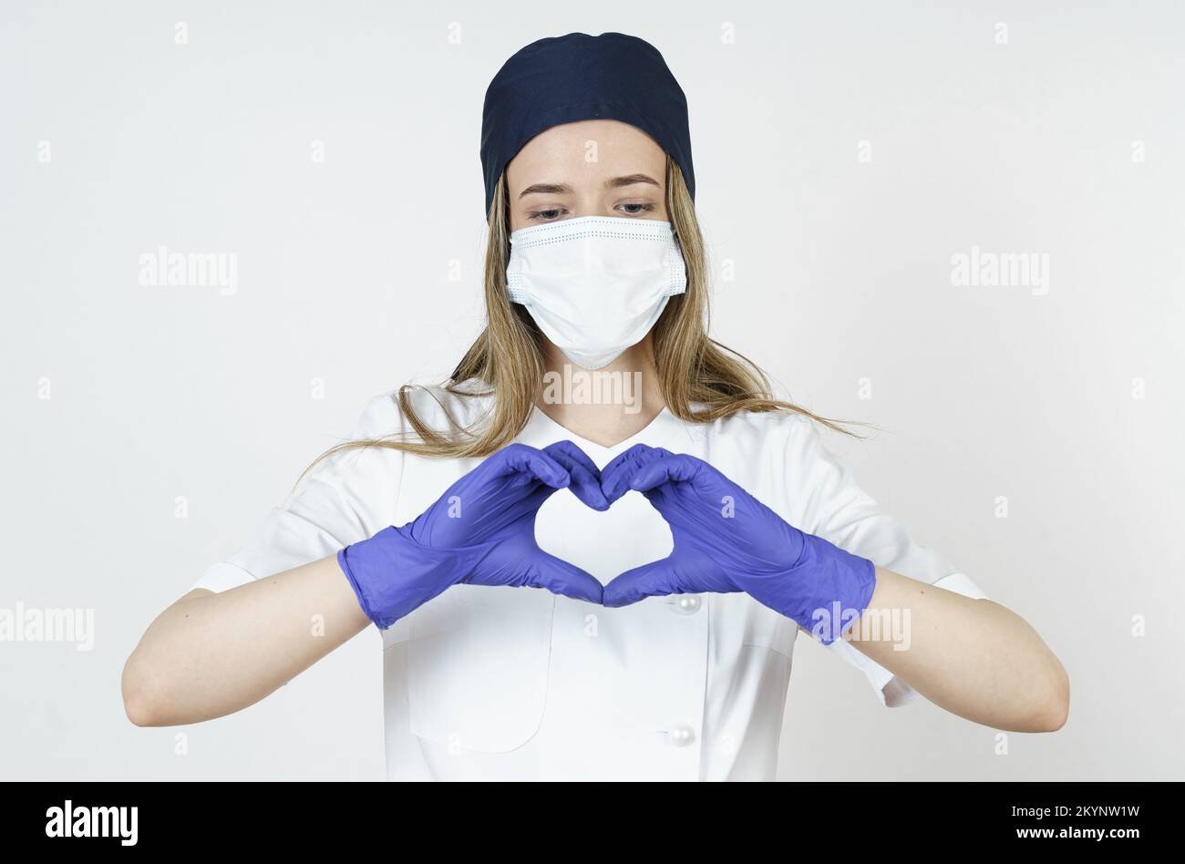 Medicine and health concept. The woman doctor folded the heart symbol ...
