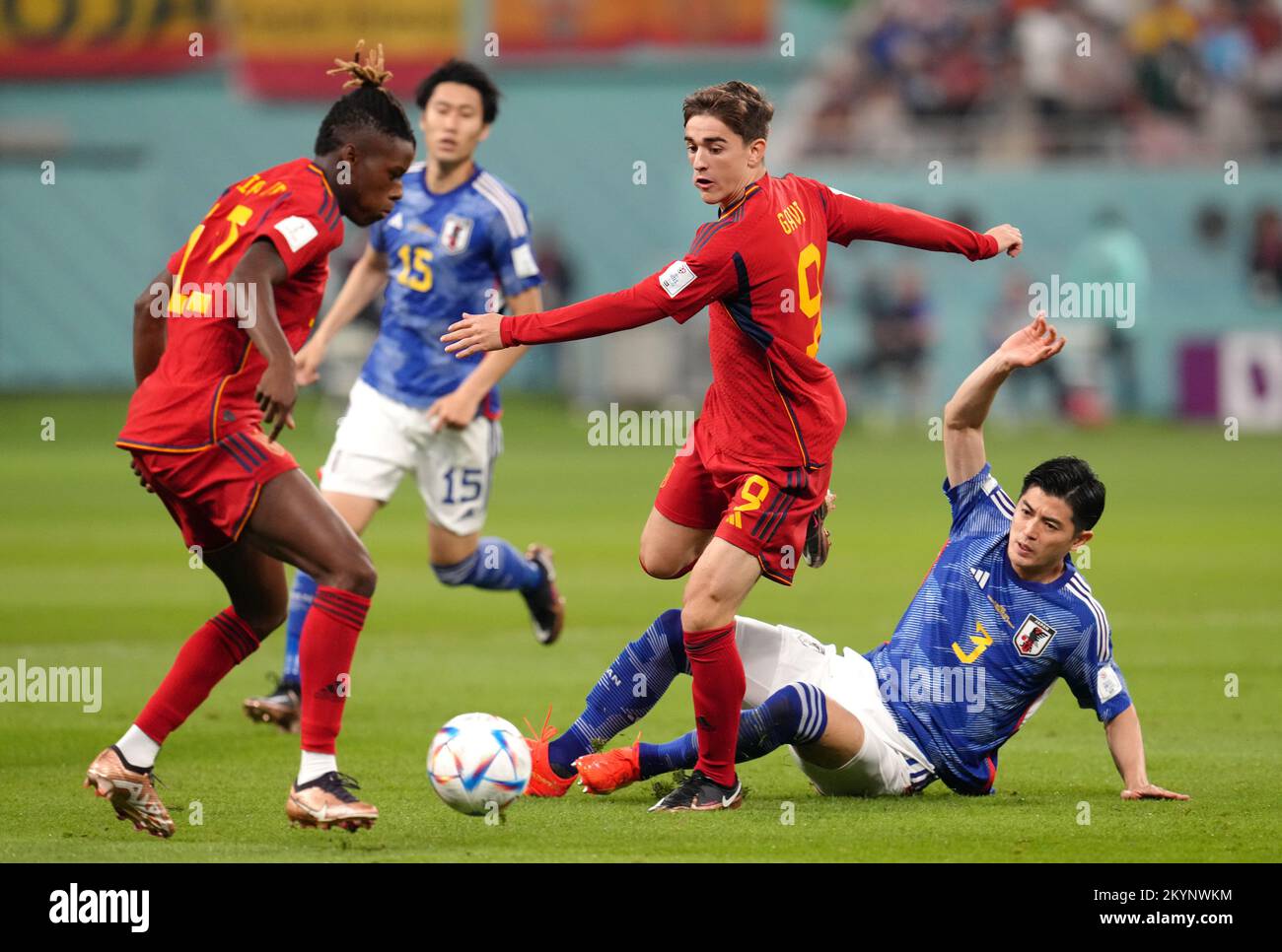 Spain's Gavi (centre) is tackled by Japan's Shogo Taniguchi during the ...