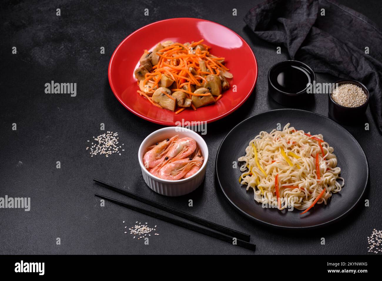 Delicious fresh rice noodles with shrimp, spices and herbs on a dark ...