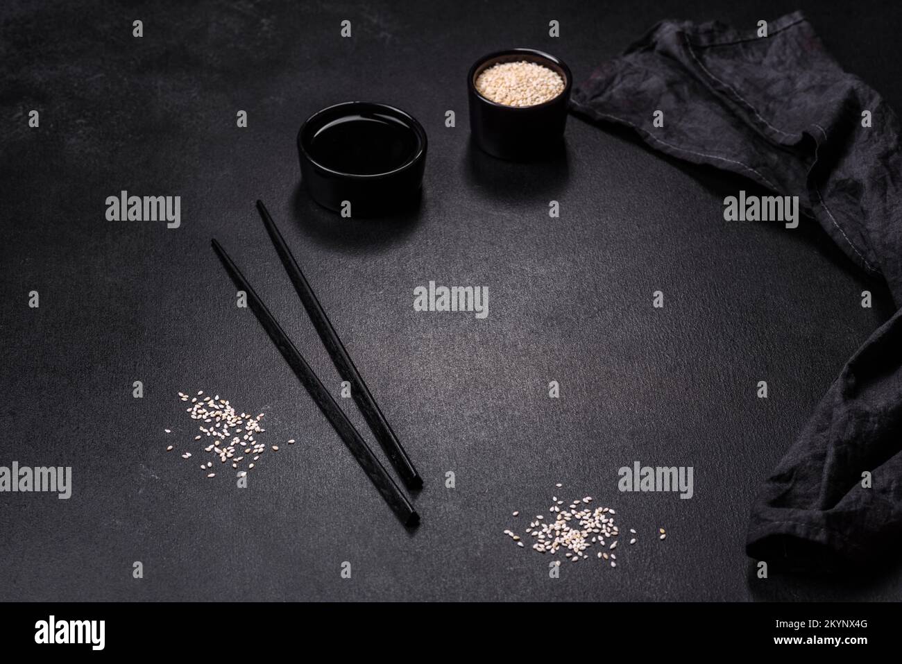 Empty plate with wooden sticks for Asian food on a dark concrete ...