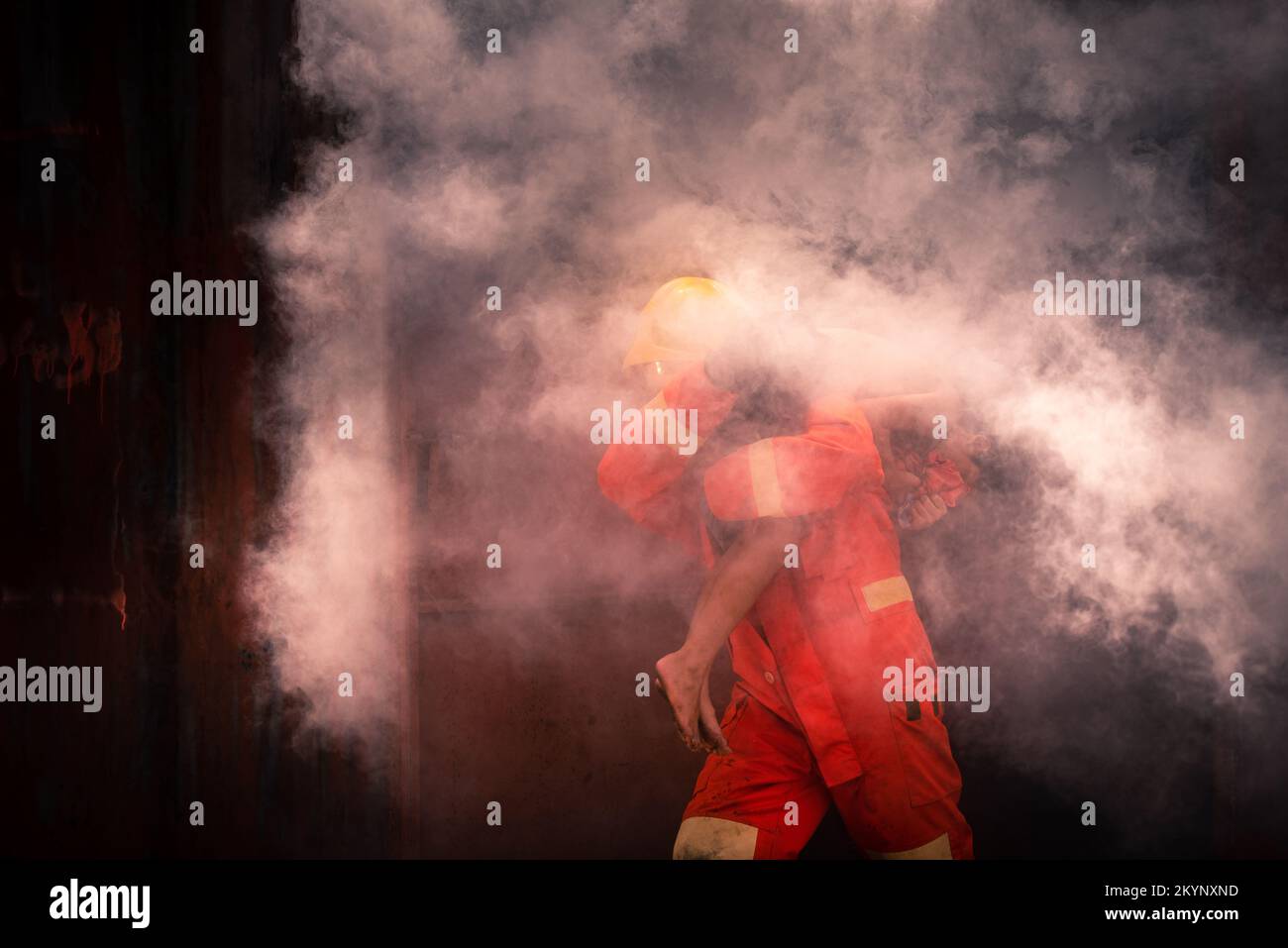 Firefighter with equipment try to help people trapped in house fire ...
