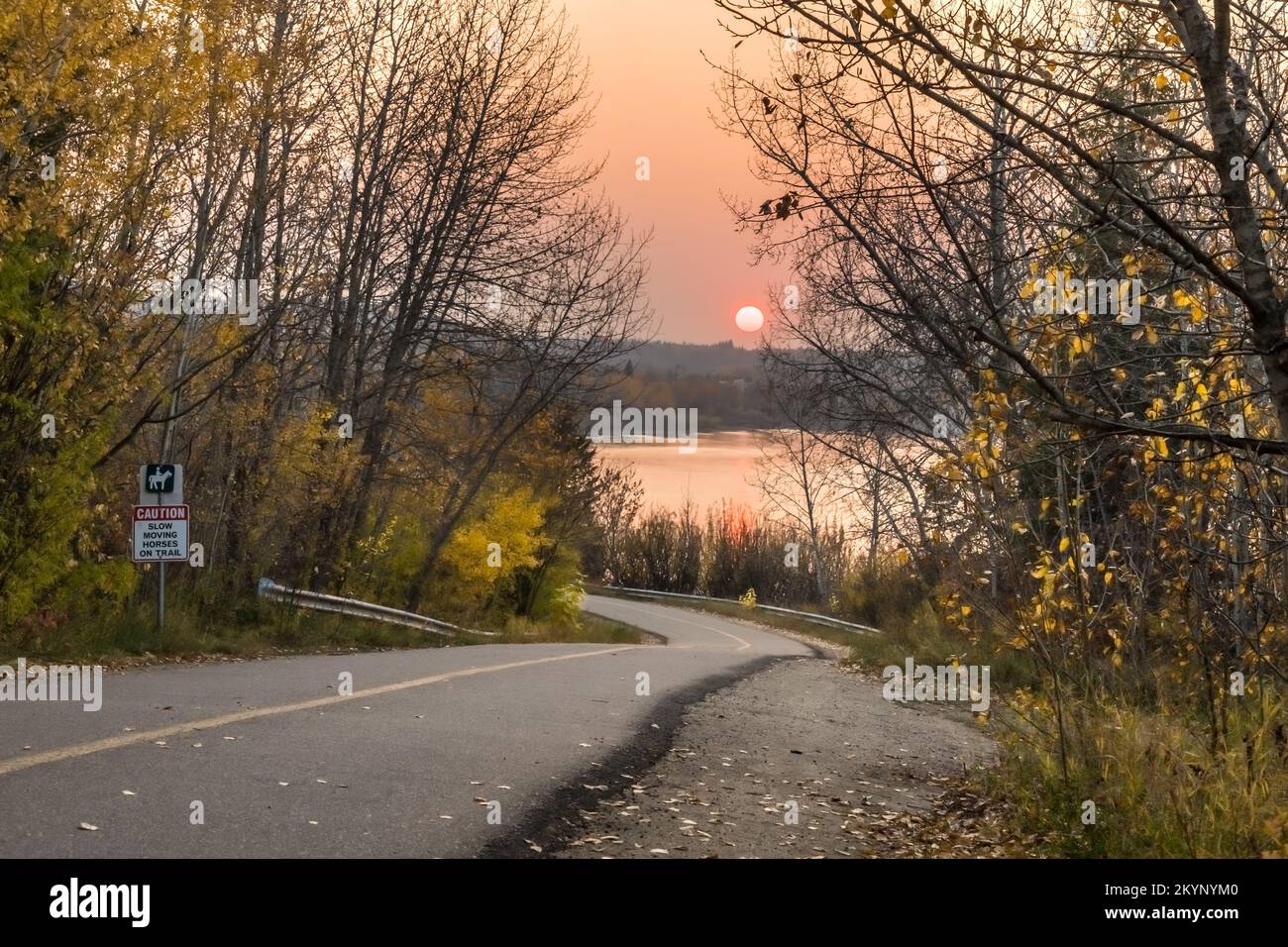 Fall sunset with the sun with haze background Stock Photo - Alamy