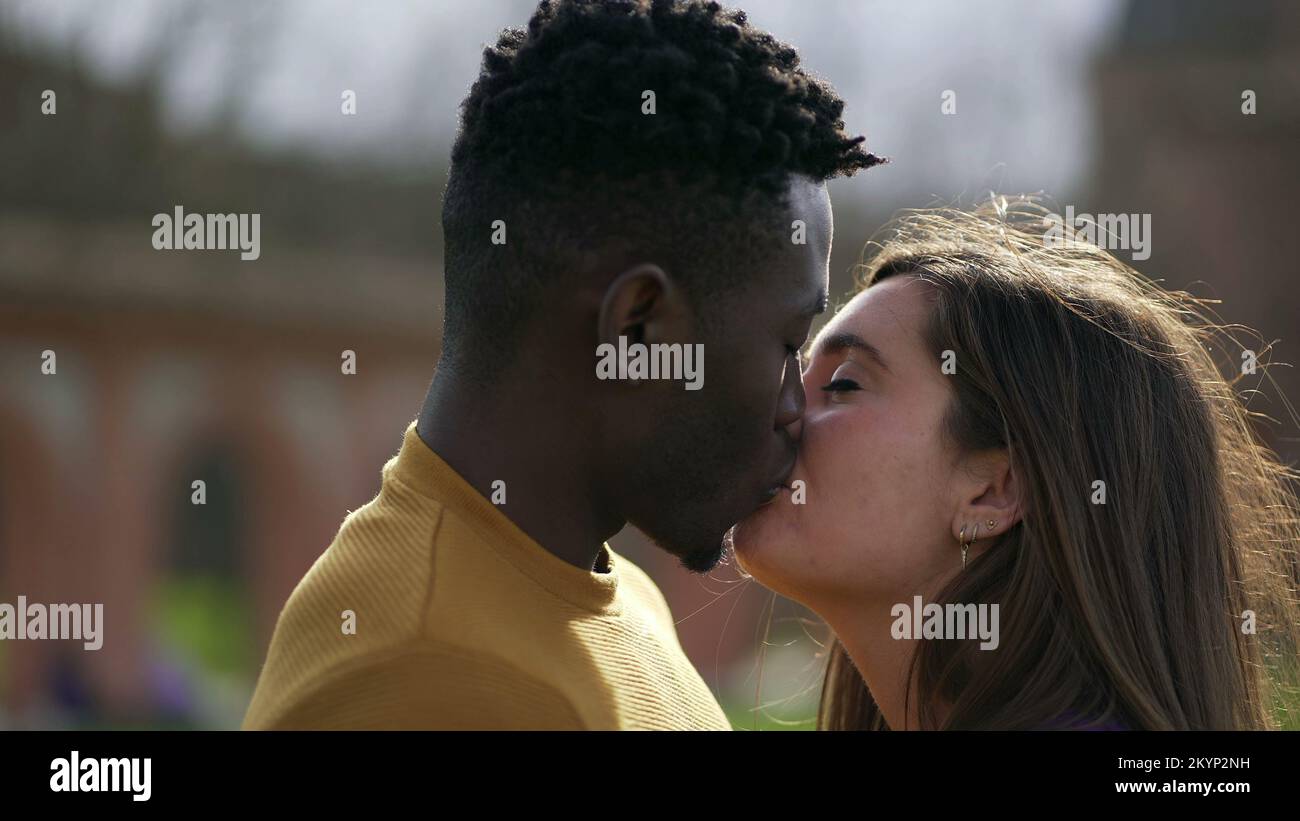 Young interracial passionate kiss. Ethnically diverse couple kissing Stock Photo - Alamy