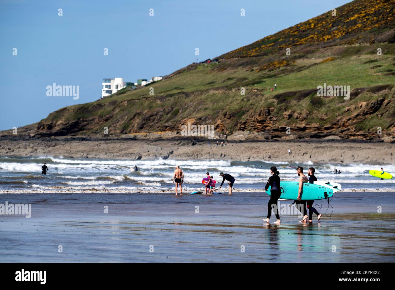 People enjoy the sunshine on the beach at Saunton Sands in Devon as the ...