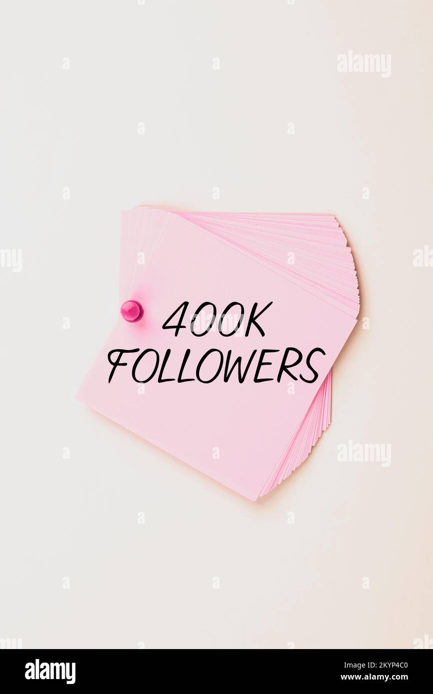 Sign displaying 400K Followers. Word Written on number of individuals ...