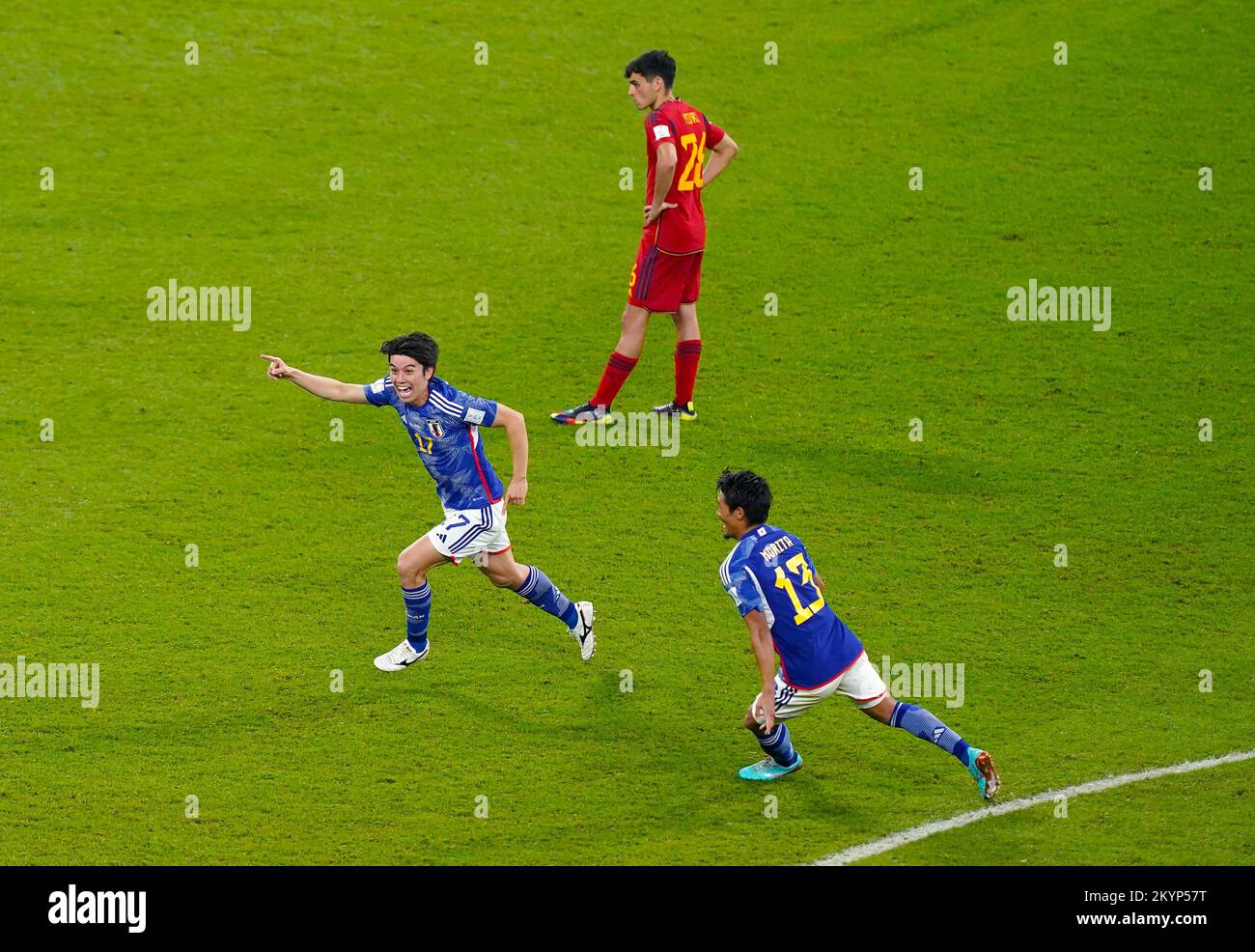 Japan's Ao Tanaka (left) celebrates scoring their side's second goal of ...