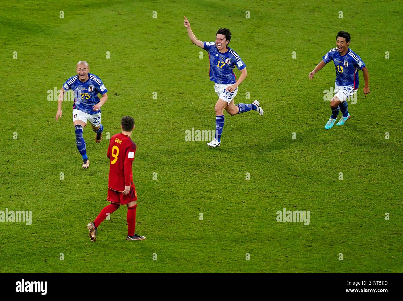 Japan's Ao Tanaka (centre) celebrates scoring their side's second goal ...