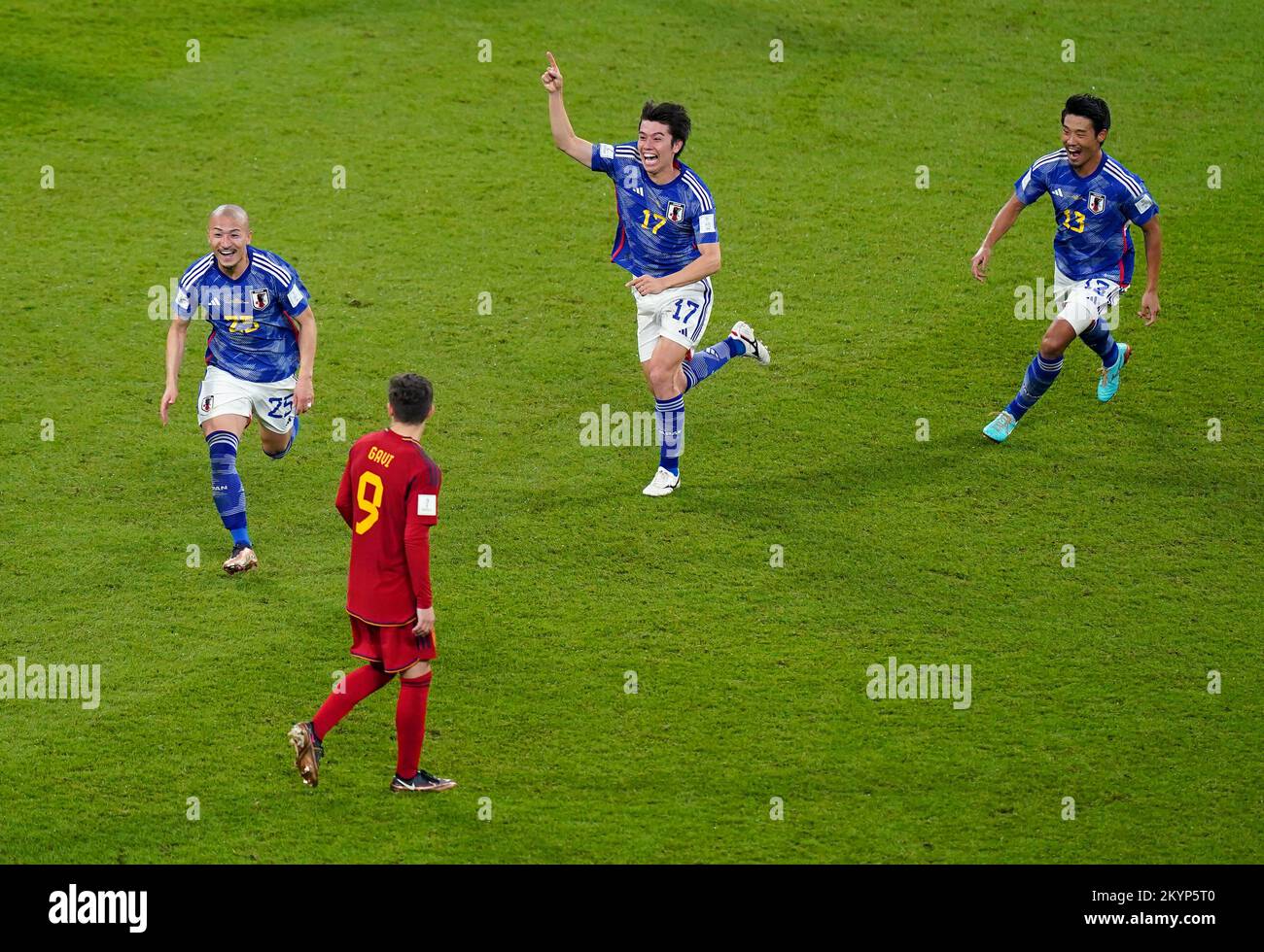 Japan's Ao Tanaka (centre) celebrates scoring their side's second goal ...