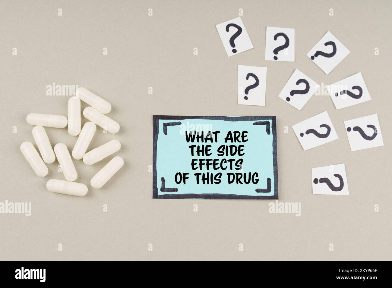Medical concept. On a gray surface there are question marks and a blue ...