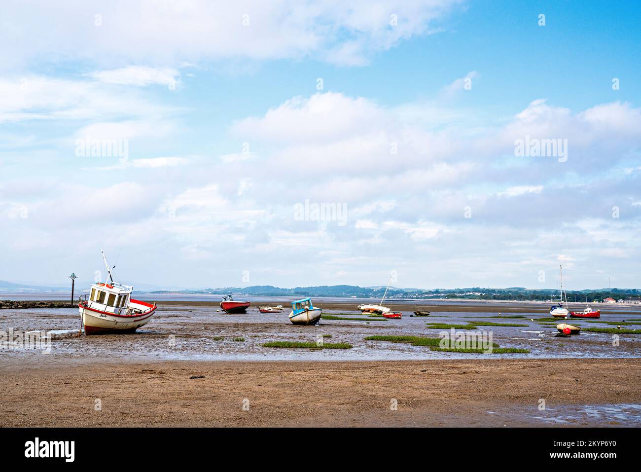Small boats in Morecambe Bay at low tide Stock Photo - Alamy