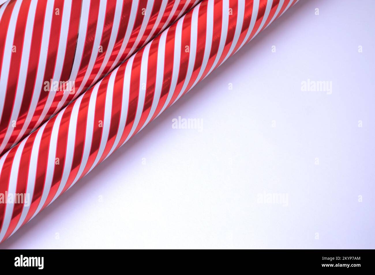 Guft wrapping paper with red and white stripes on white background with ...