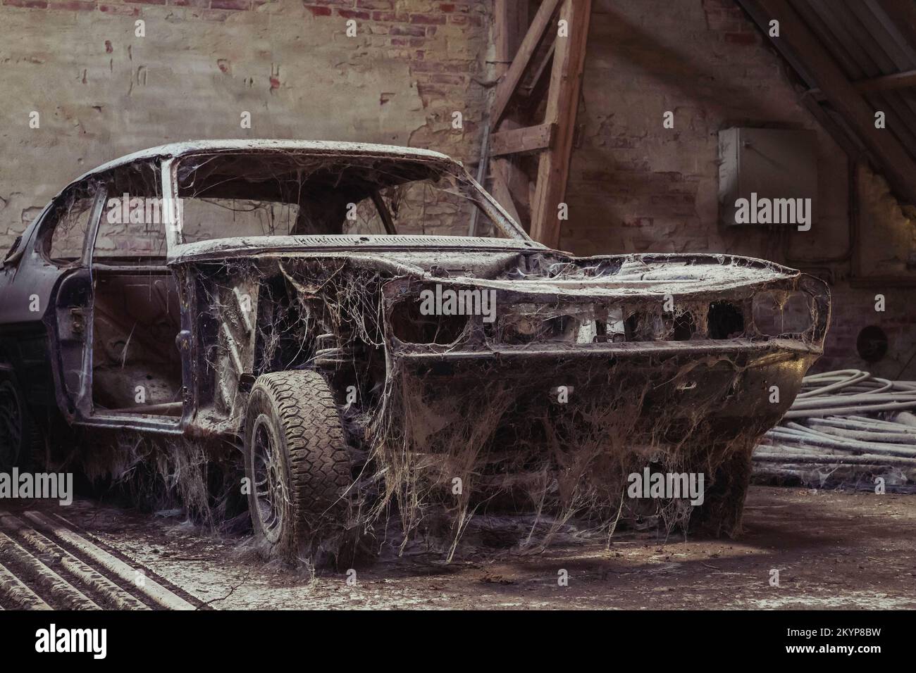 Old disassembled car in an abandoned factory Stock Photo - Alamy