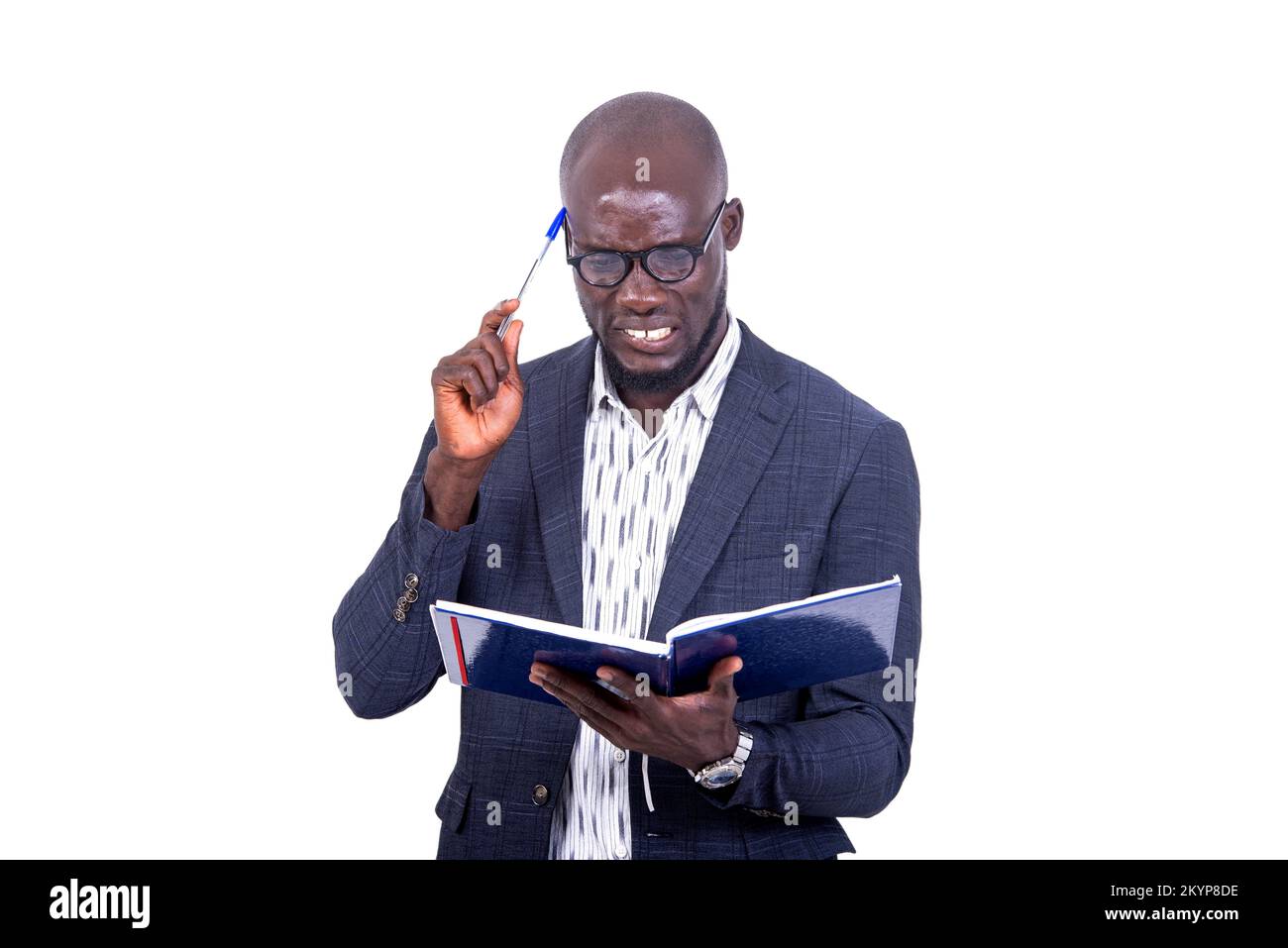 a young businessman in a jacket standing on a white background holding ...