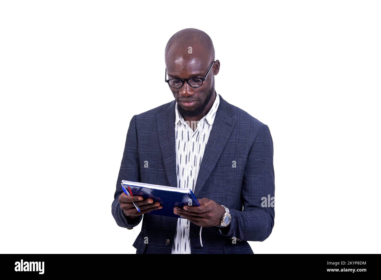 a young businessman in jacket standing on white background holding a ...