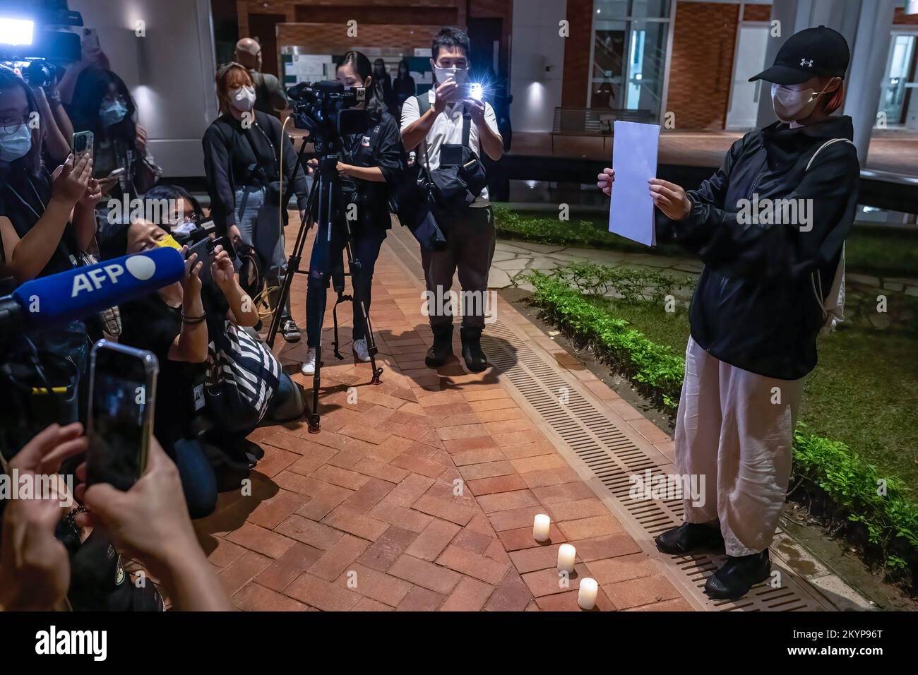 Hong Kong, China. 29th Nov, 2022. A masked protester holds an A4 blank ...