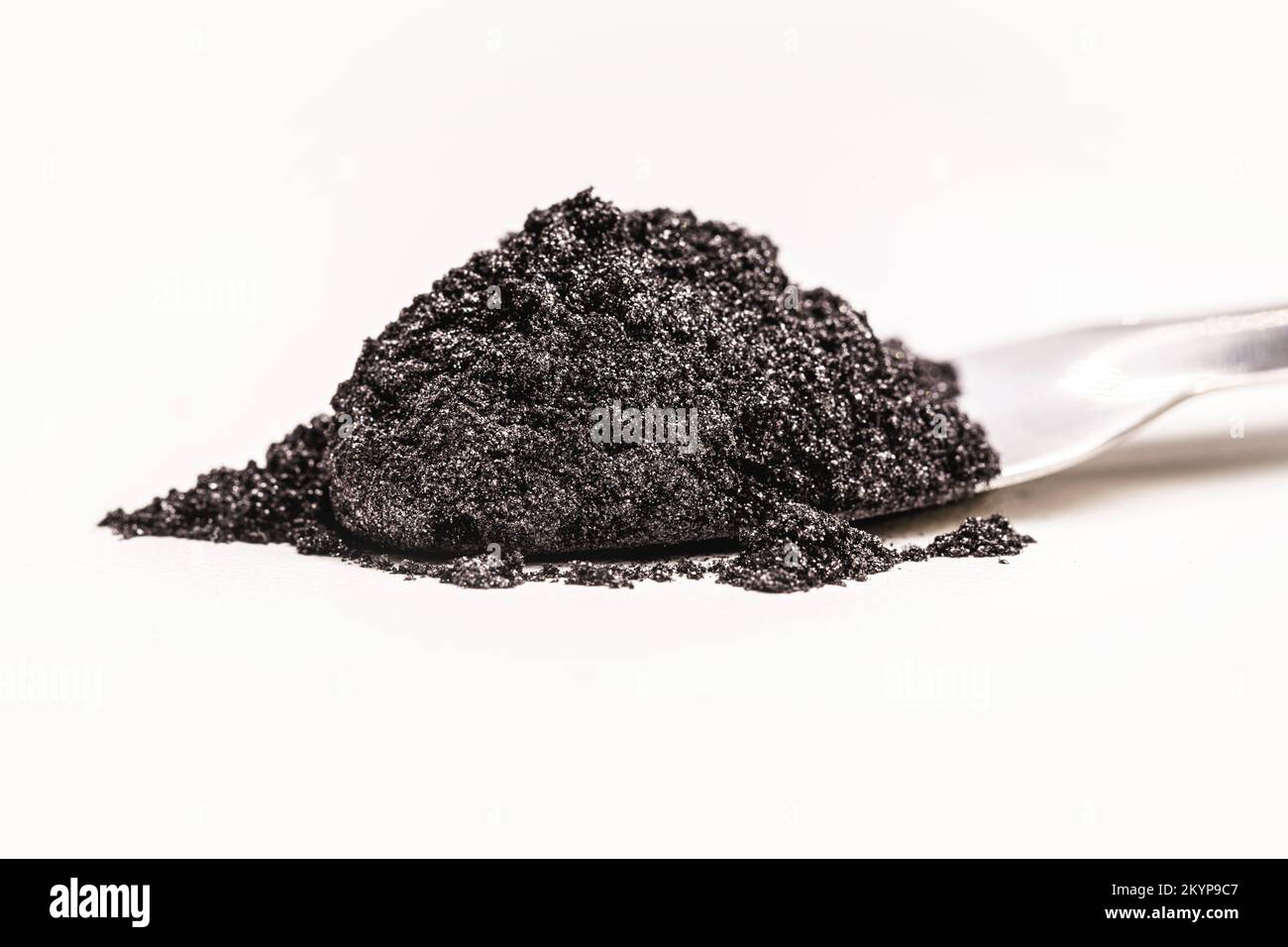 black pigment, powder for industrial or cosmetic use, isolated white ...