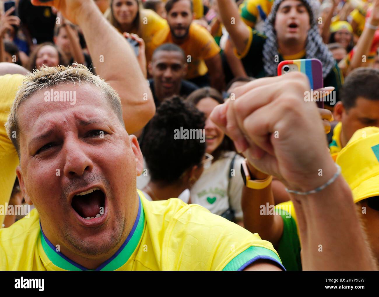 Brazilian fans celebrating goal score to support national soccer team playing Fifa World Cup at ...
