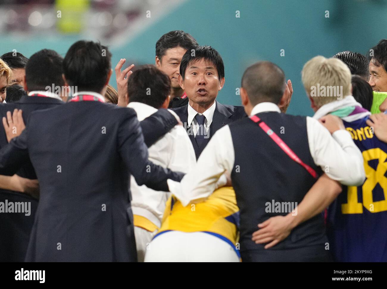 Japan manager Hajime Moriyasu speaks with his players after the final ...