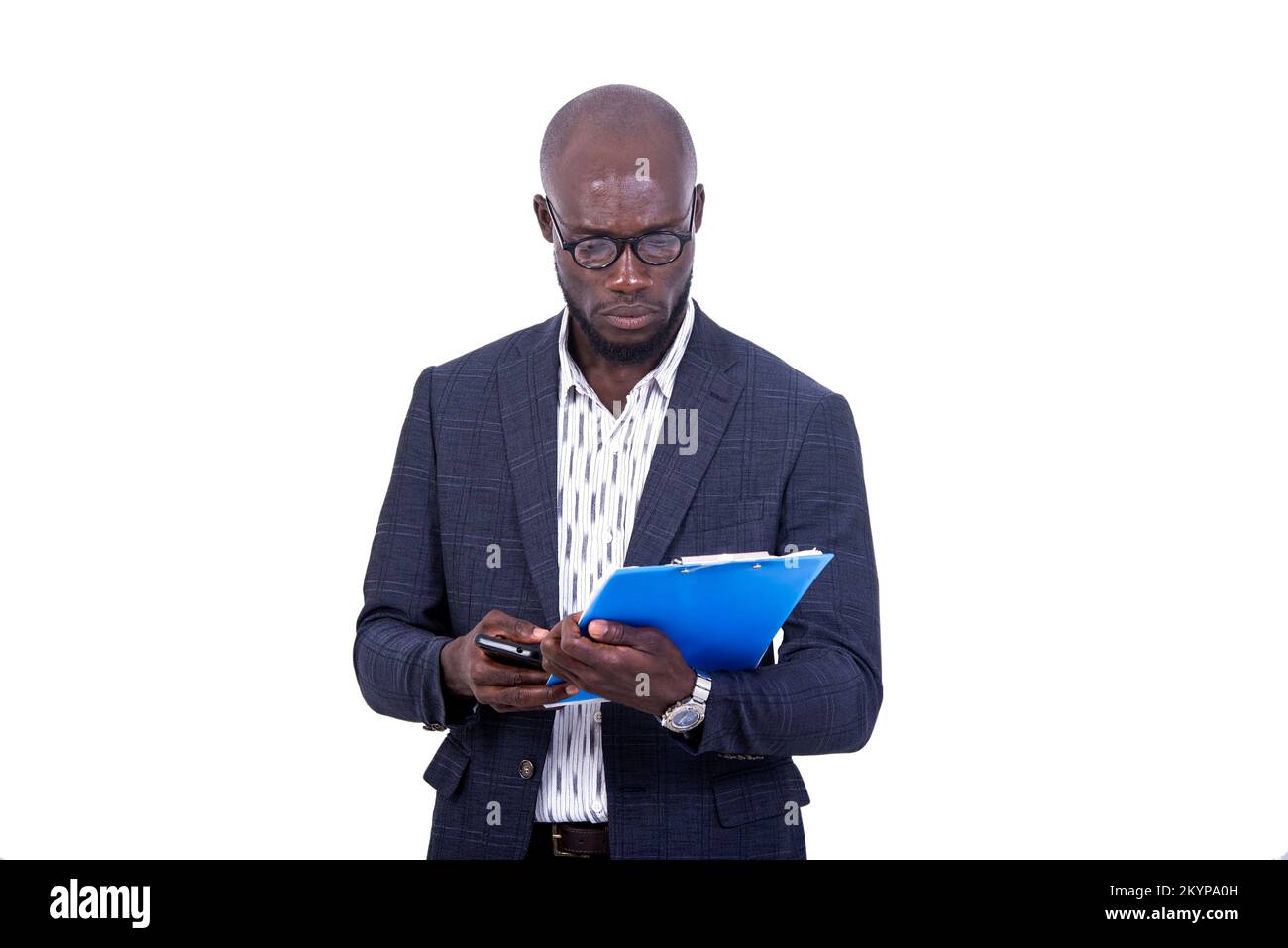 portrait of a handsome serious adult businessman reading the document ...