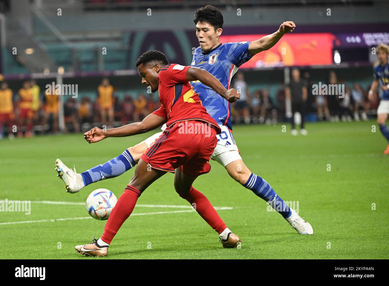 Doha, Qatar. 1st Dec, 2022. Ansu Fati of Spain vies with Tomiyasu ...