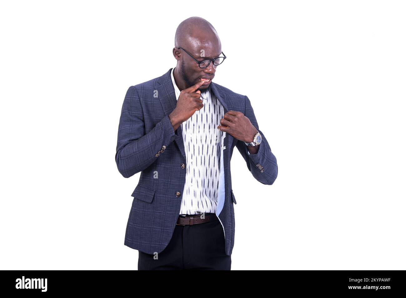 portrait of a handsome businessman thinking with finger on lips ...