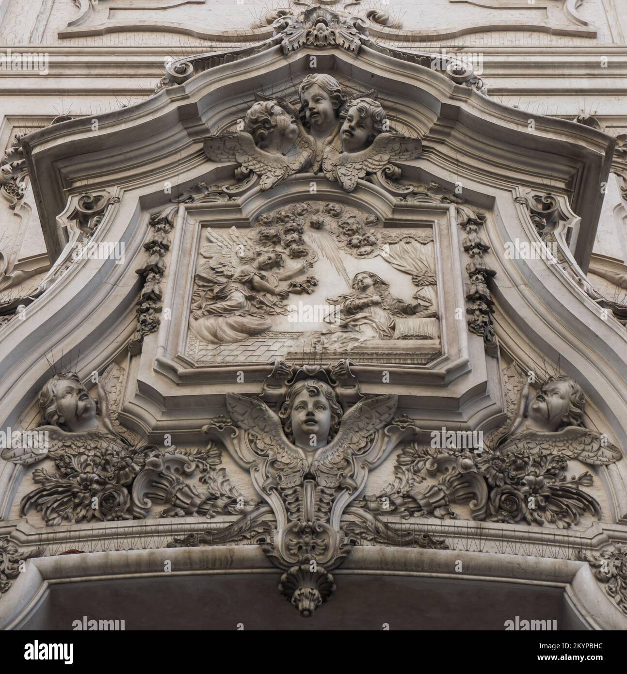 Ancient bas-reliefs with angels above the entrance to the Catholic ...