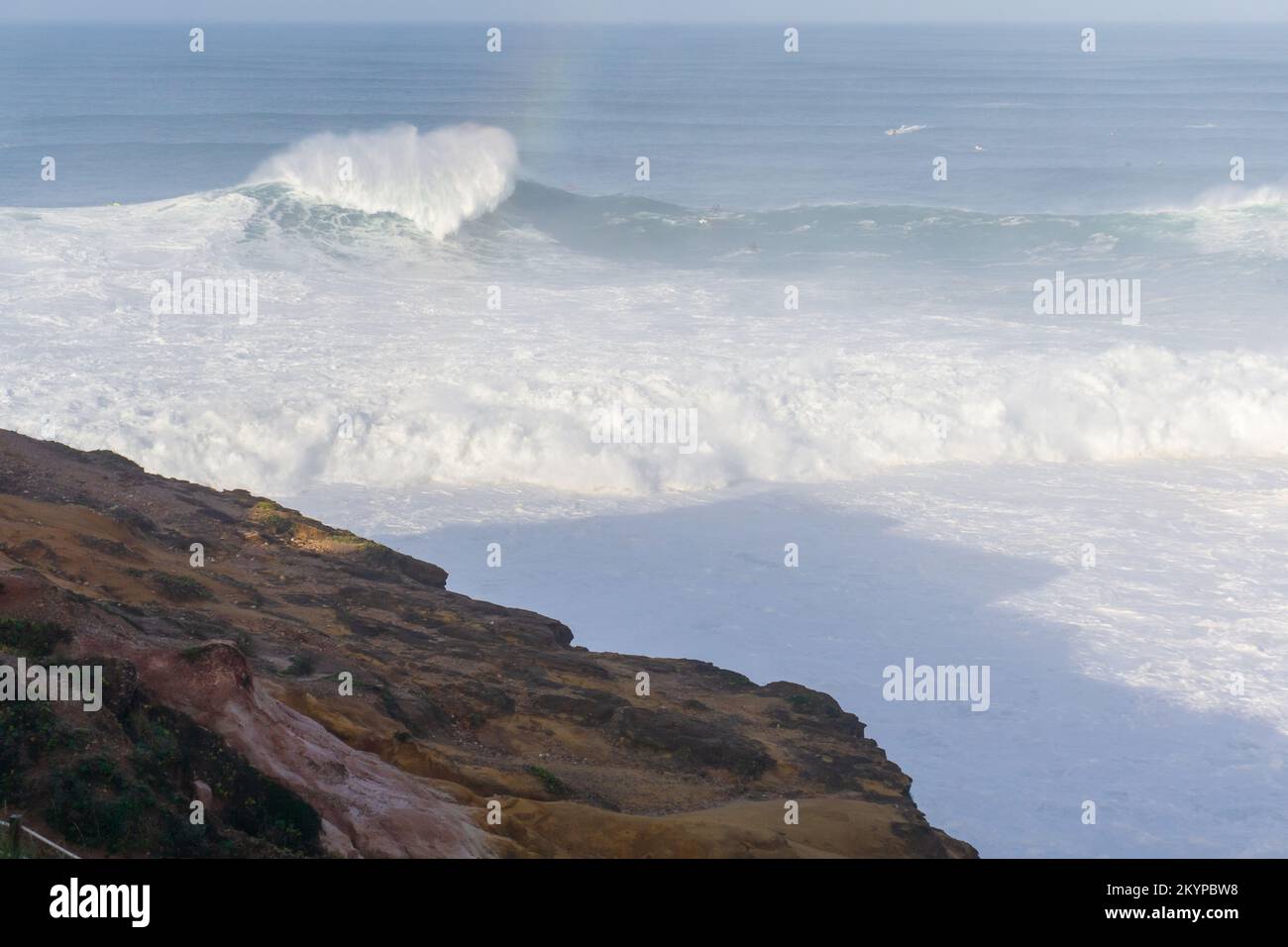 View from high cliff to the waves in Nazare Stock Photo - Alamy