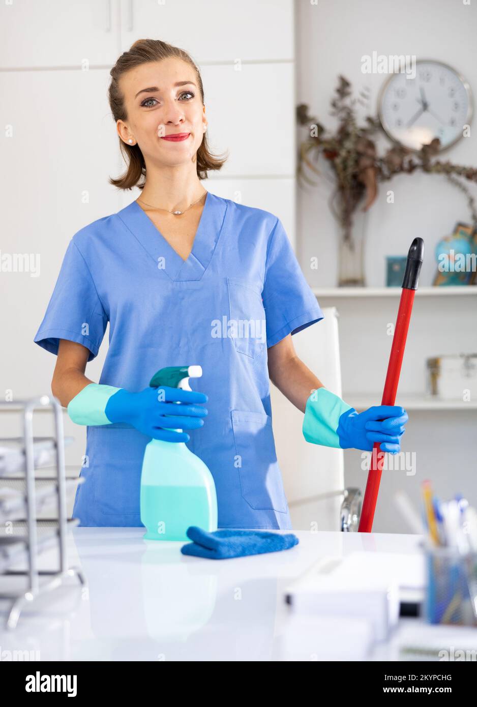 Portrait of cleaning company cleaner in office Stock Photo - Alamy