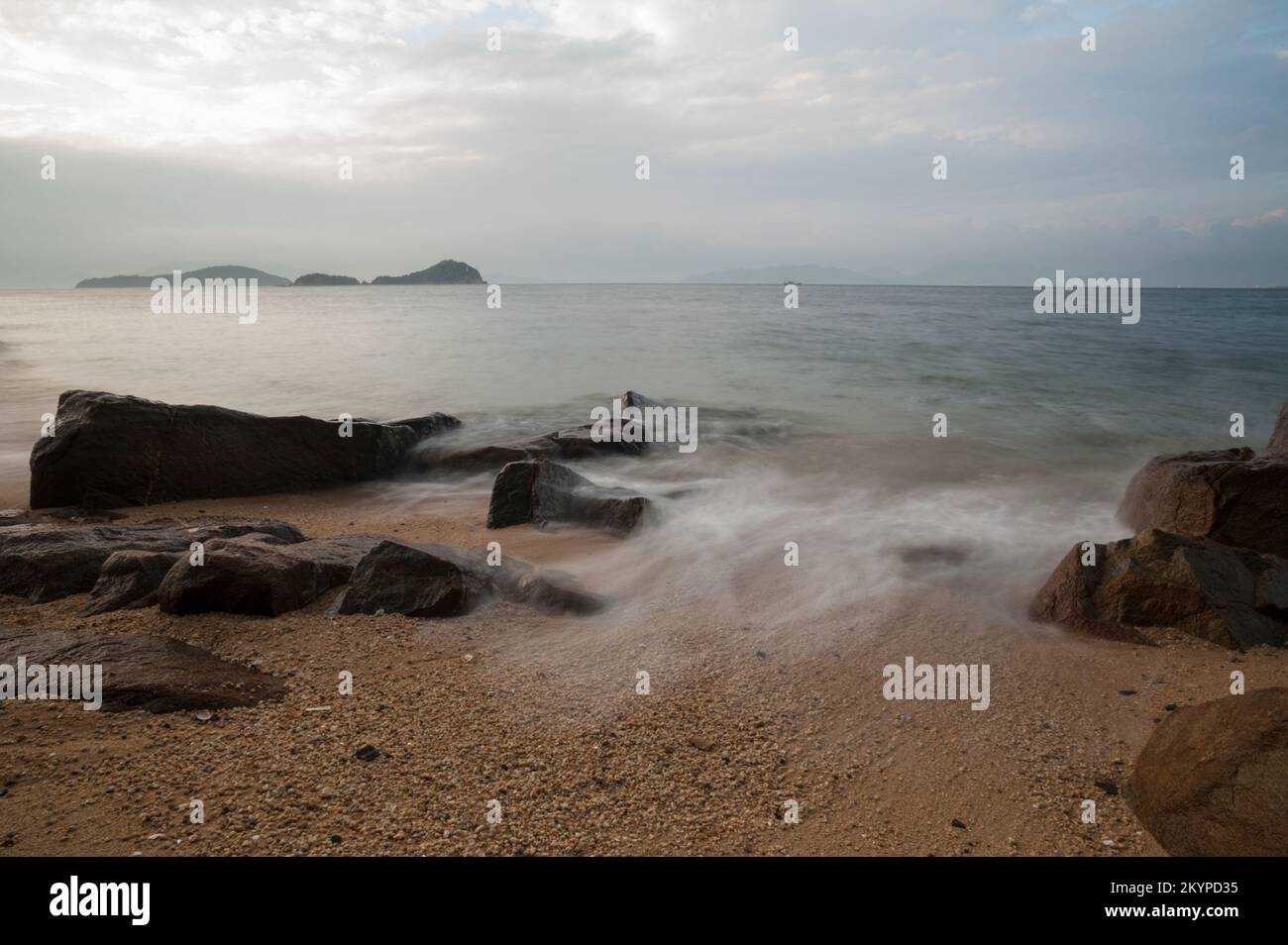 The rocky Seto Insland Sea Beach near Aji, Kagawa, with islands in the ...