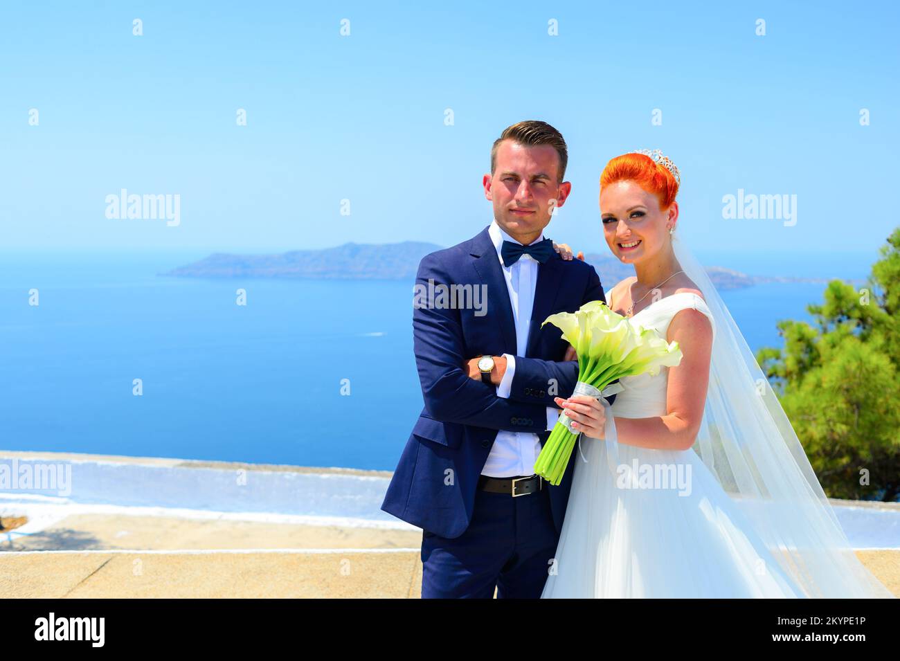 Beautiful young couple bride and groom celebrate wedding on Santorini ...