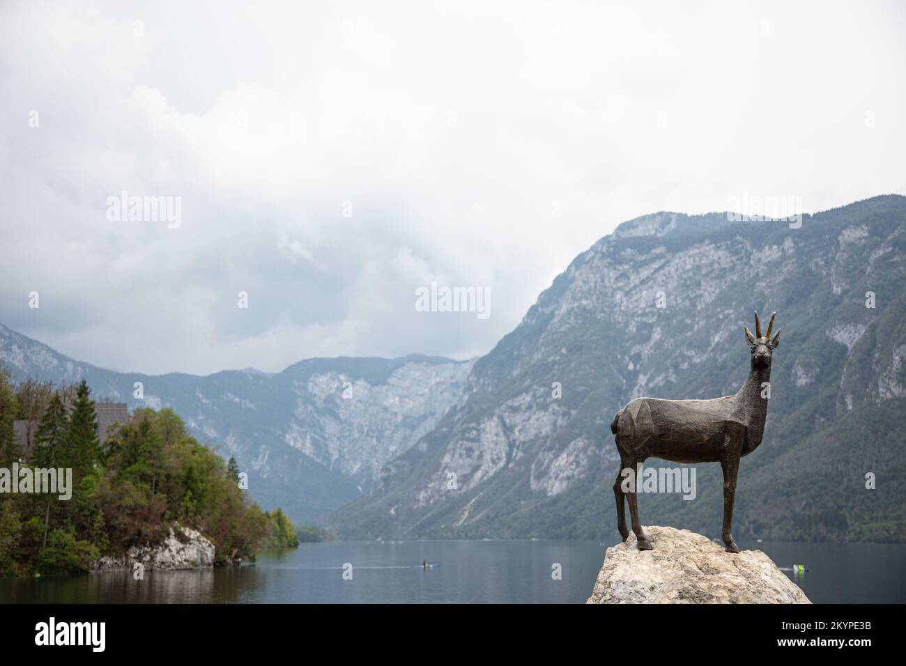 Bronze statue of Goldhorn Zlatorog deer next to Lake Bohinj in Triglav ...