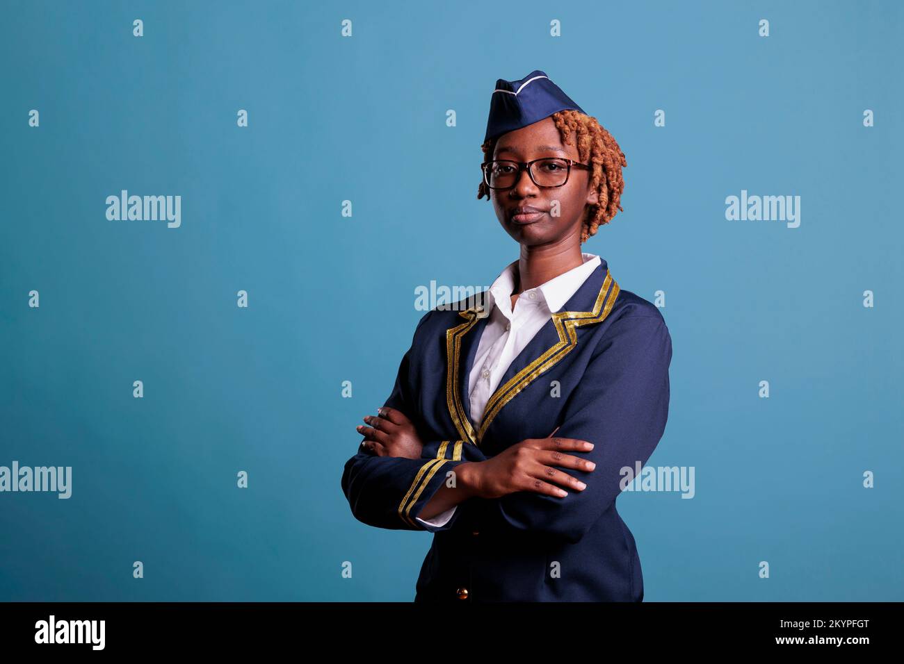 Serious female african american airline attendant analyzing options for ...